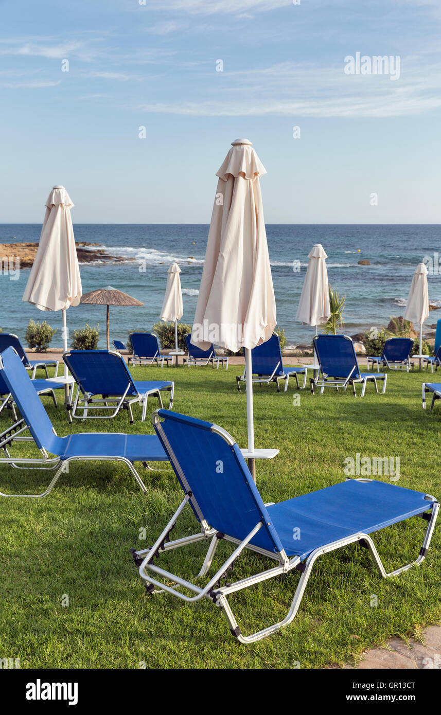 Mediterranean beach with empty sunbeds in Cyprus Stock Photo - Alamy