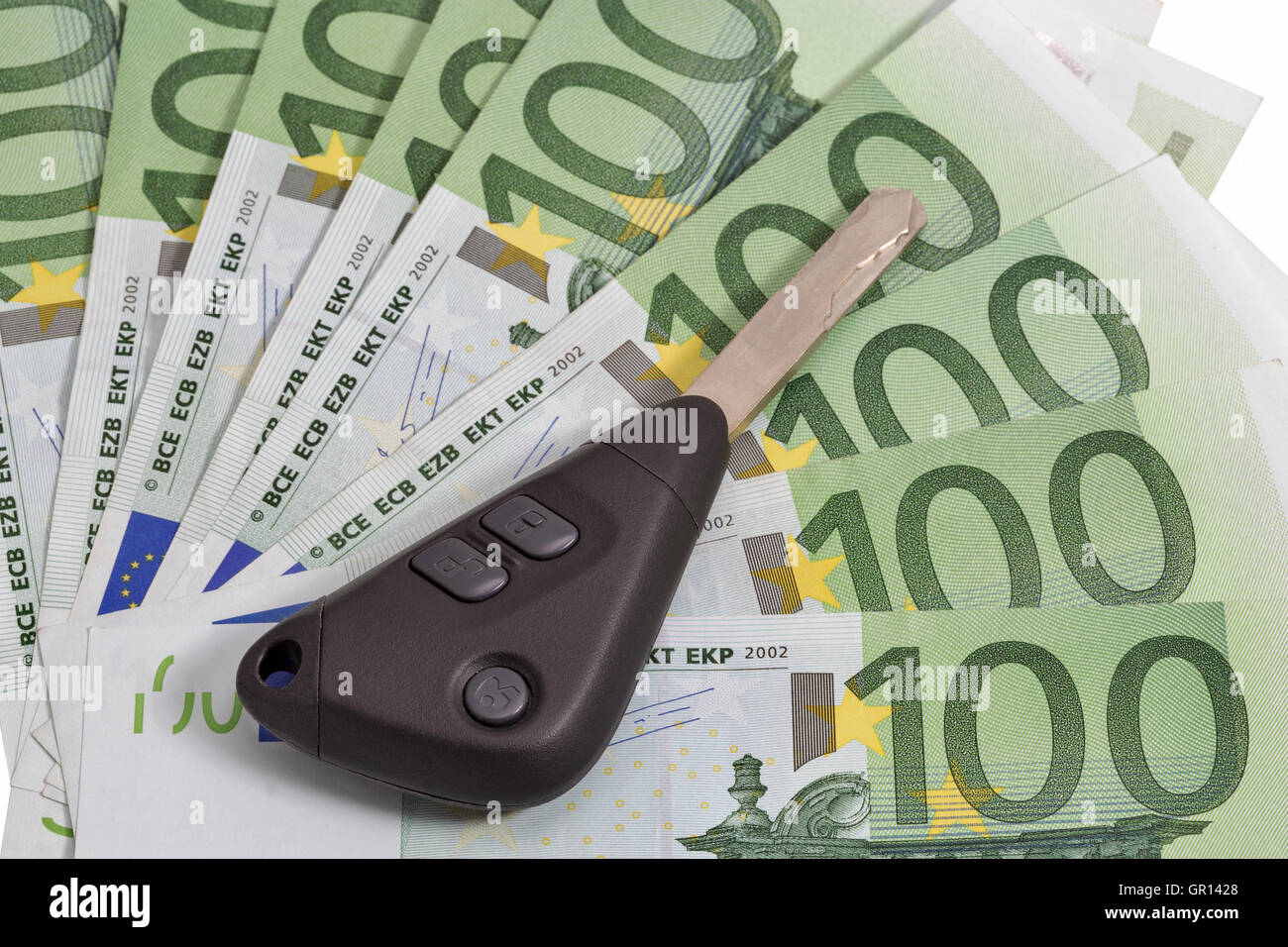 Car keys on 100 Euro bills background macro Stock Photo - Alamy