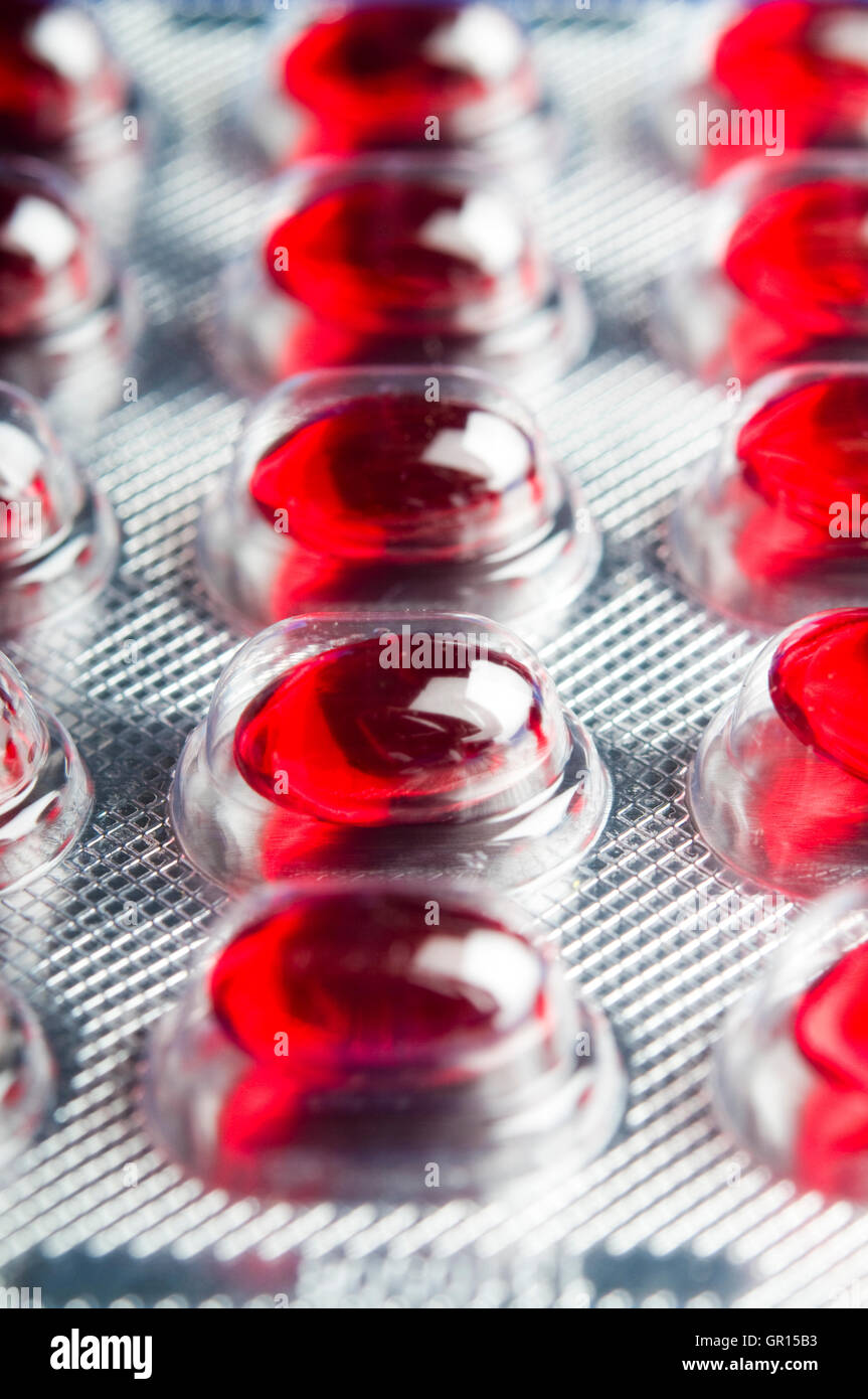 red capsule in blister Stock Photo - Alamy