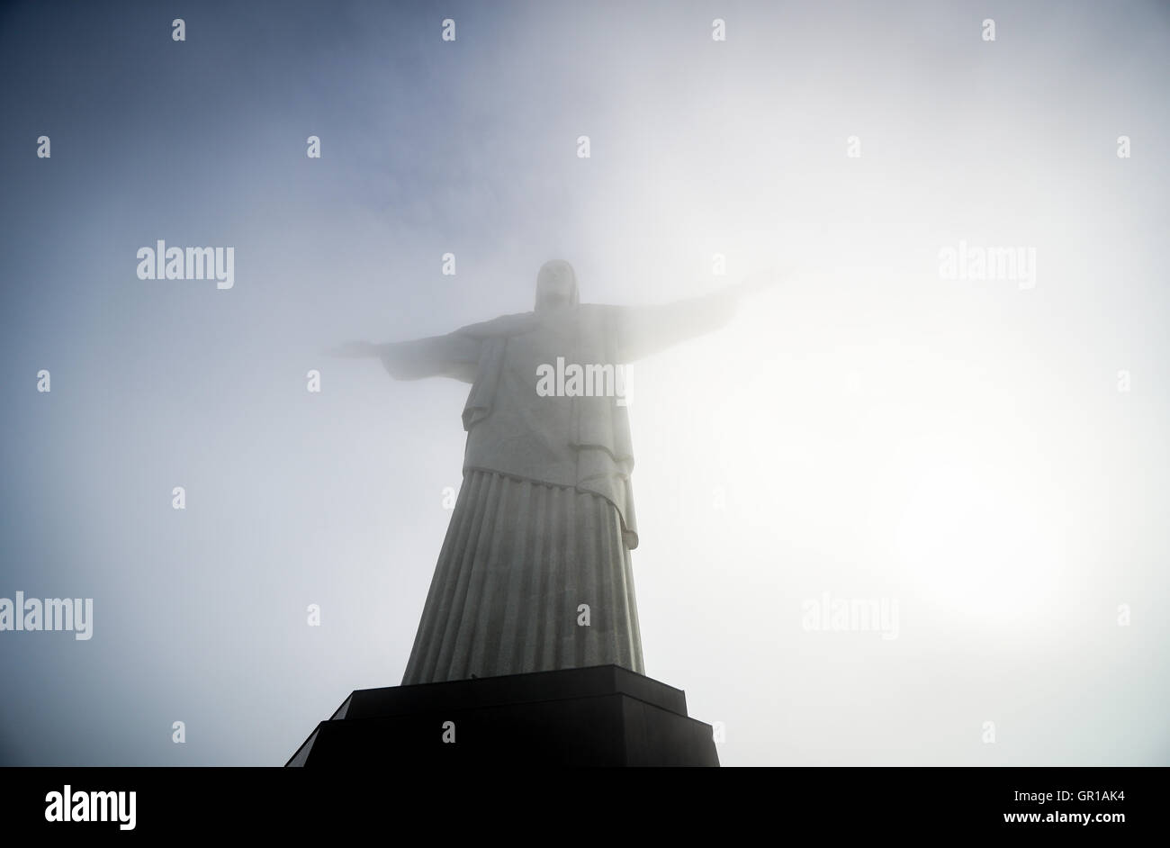 The picture shows Christ the Redeemer (Cristo Redentor) statue atop ...