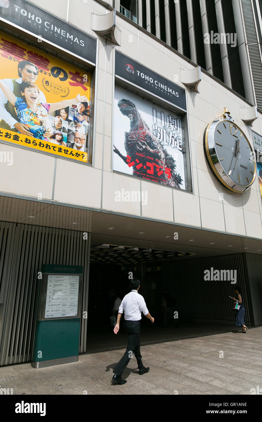 A man walks past under a poster of Shin Godzilla on display at Toho ...