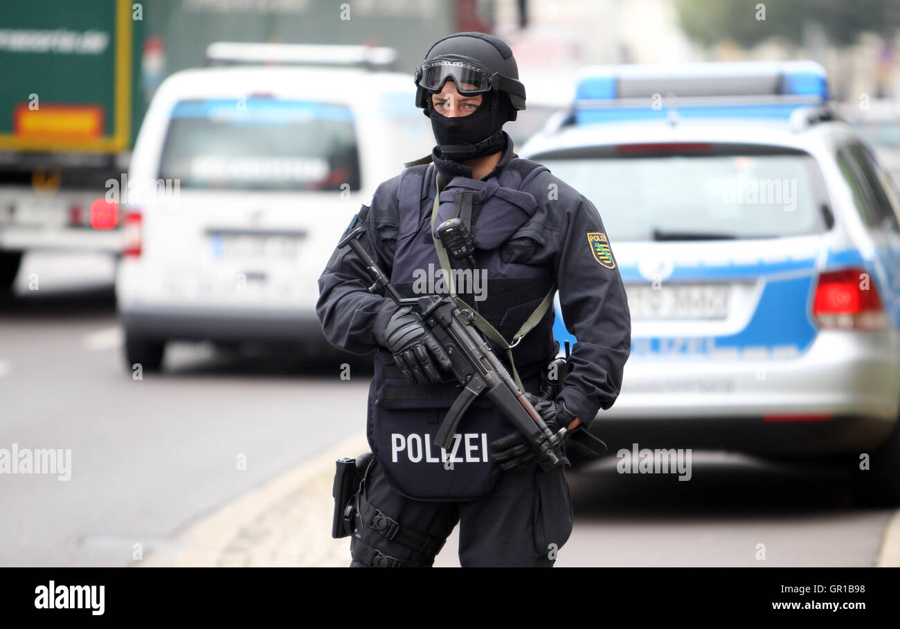 Leipzig, Germany. 06th Sep, 2016. A police officer in a helmet and ...