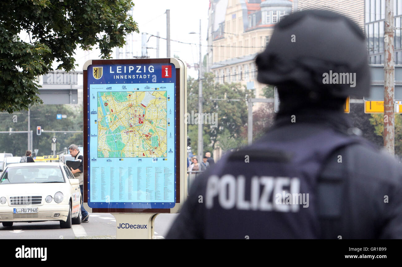 Leipzig, Germany. 06th Sep, 2016. A police officer in a helmet and ...
