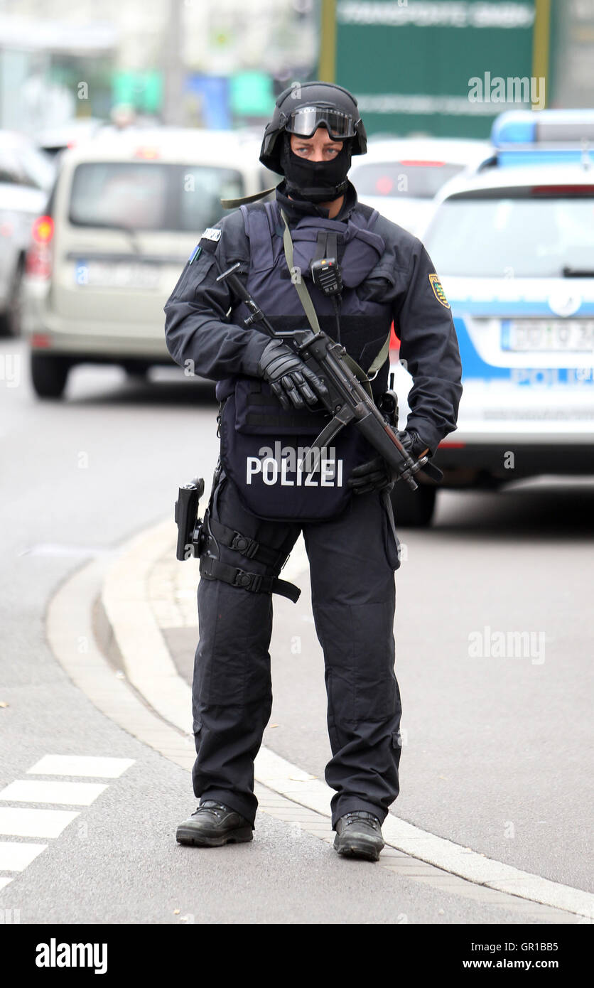 Leipzig, Germany. 06th Sep, 2016. A police officer in a helmet and ...