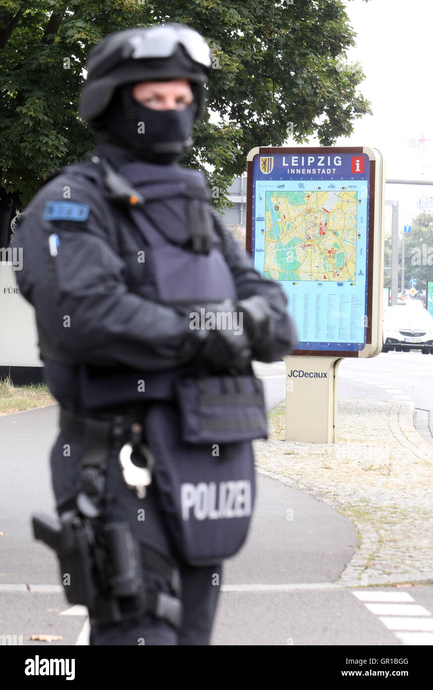 Leipzig, Germany. 06th Sep, 2016. A police officer in a helmet and ...