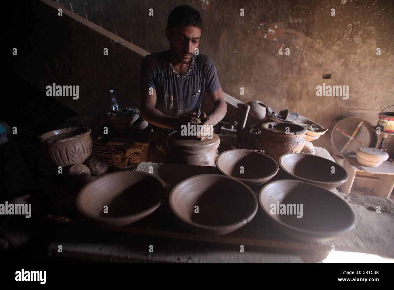 Cairo, Egypt. 5th Sep, 2016. A worker makes pottery at a workshop in ...
