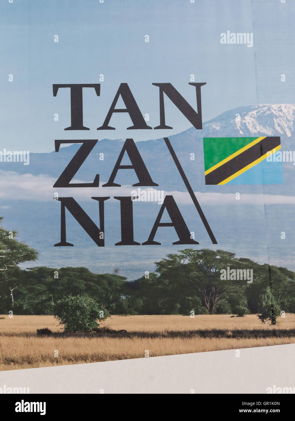 Word Tanzania Emblem and Image with Mountains and Vegetations at ...
