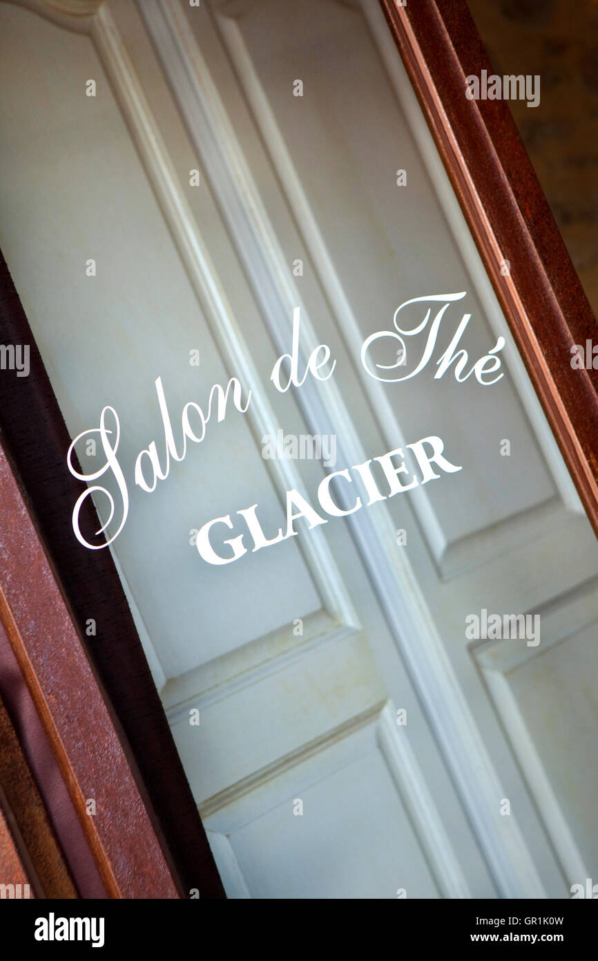 Signs on the door of a vintage French tea room Stock Photo - Alamy