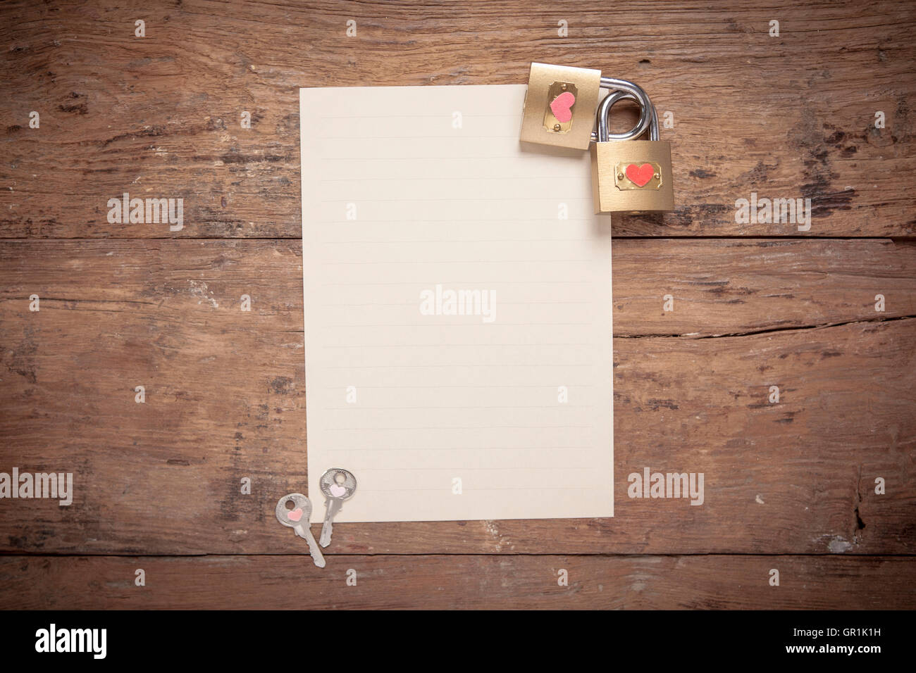 Keys and locks on letter paper Stock Photo - Alamy
