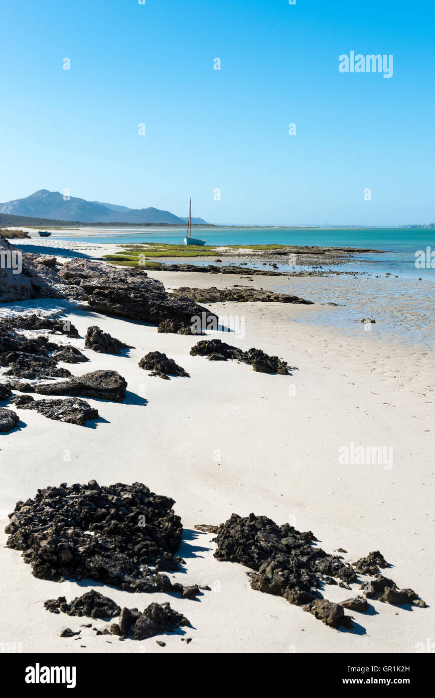 Beach with rocks and boat in Langebaan Lagoon, Churchhaven, West Coast ...