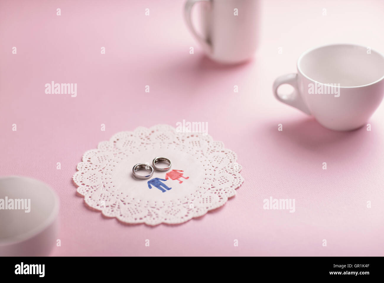 Wedding rings on doily Stock Photo - Alamy