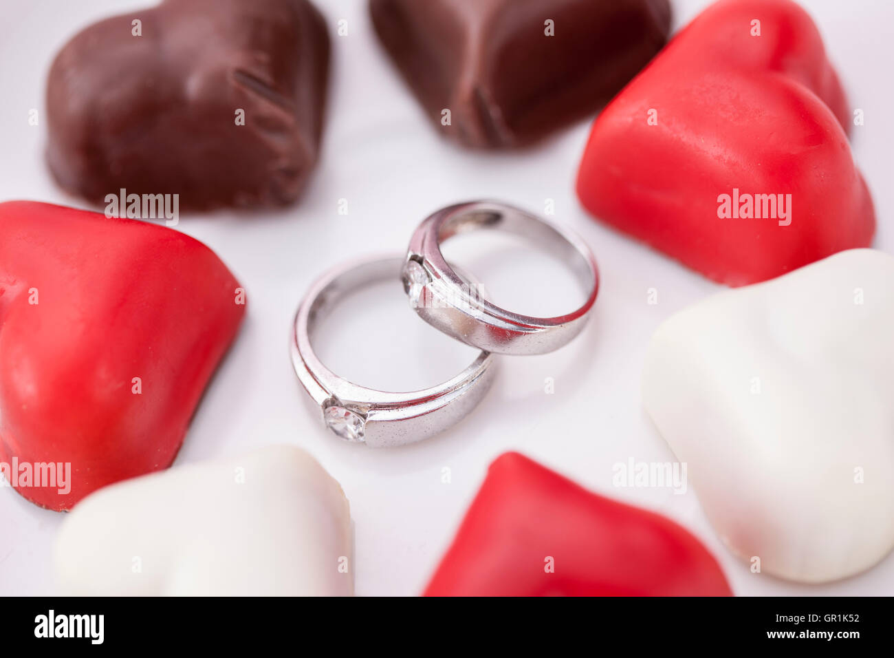 Wedding rings and chocolates Stock Photo - Alamy