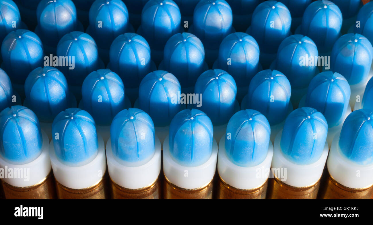 Handgun rounds that have a blue dye instead of bullets for marking a ...