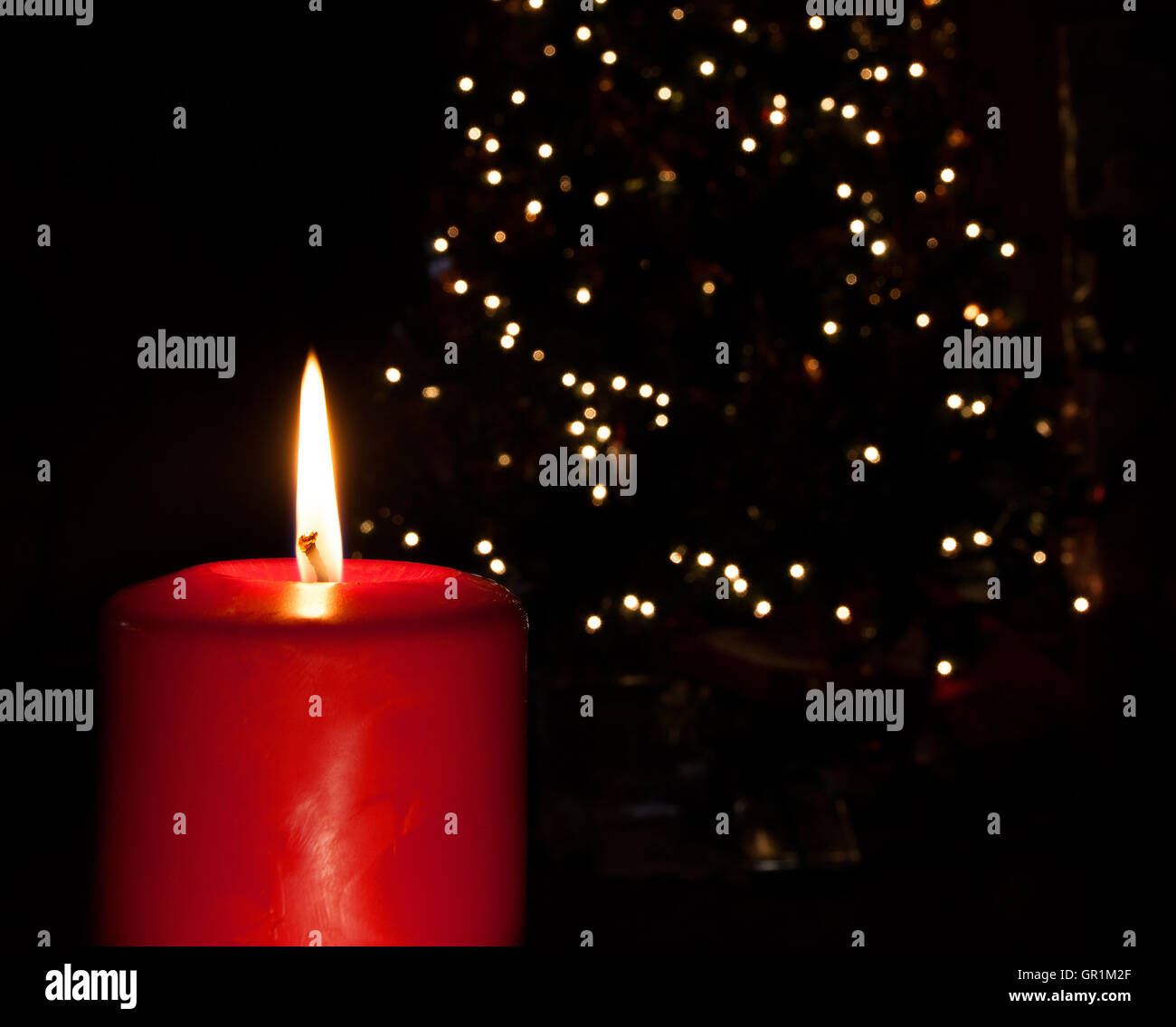 Single red candle burning in hi-res stock photography and images - Alamy