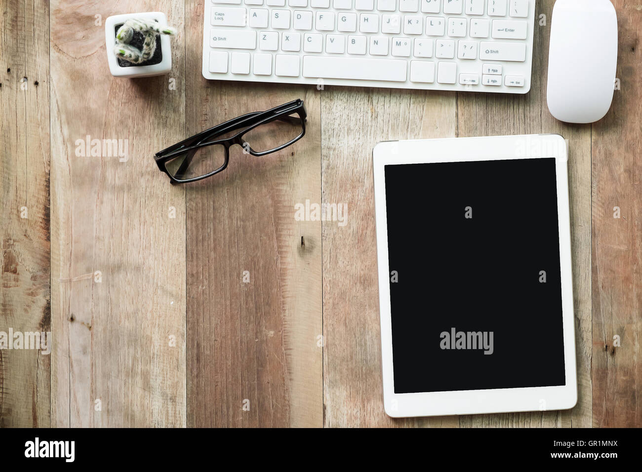 desk work with computer, supplies, tablet, calculator, pen and glasses ...