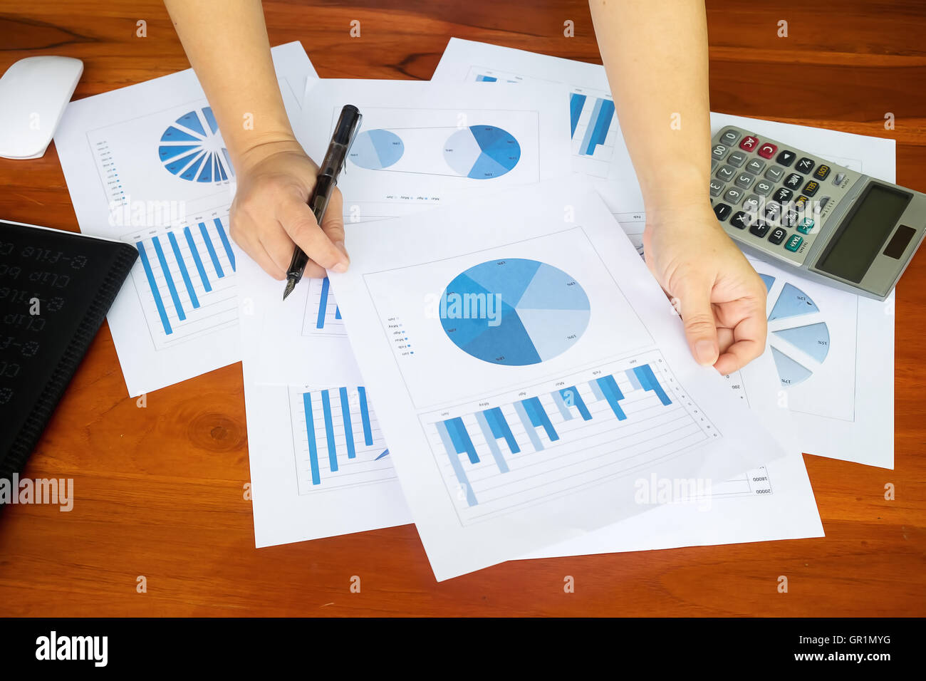Asian Business woman discussion and analysis data at meeting Stock ...