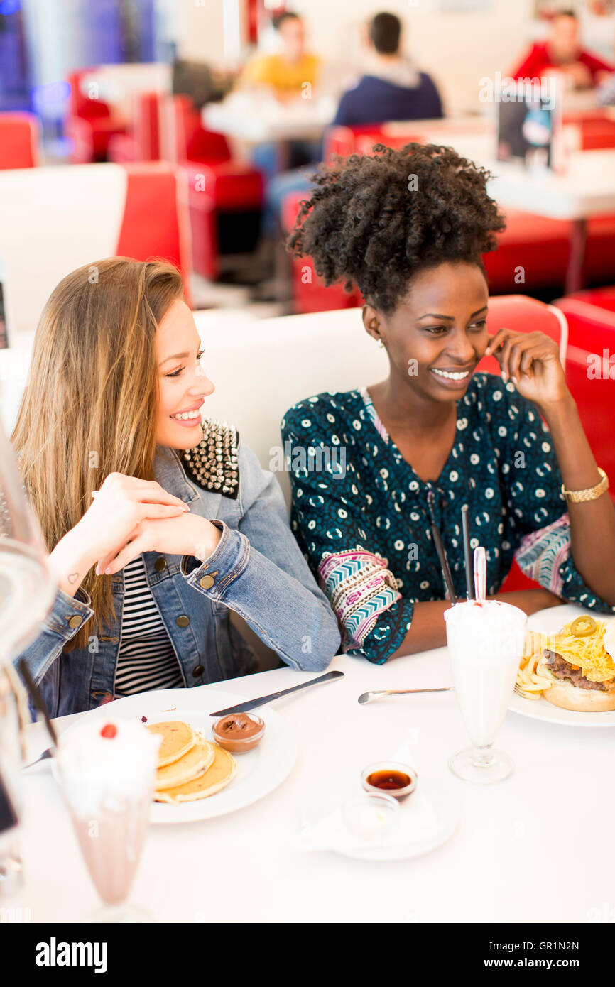 Women eating junk food hi-res stock photography and images - Alamy