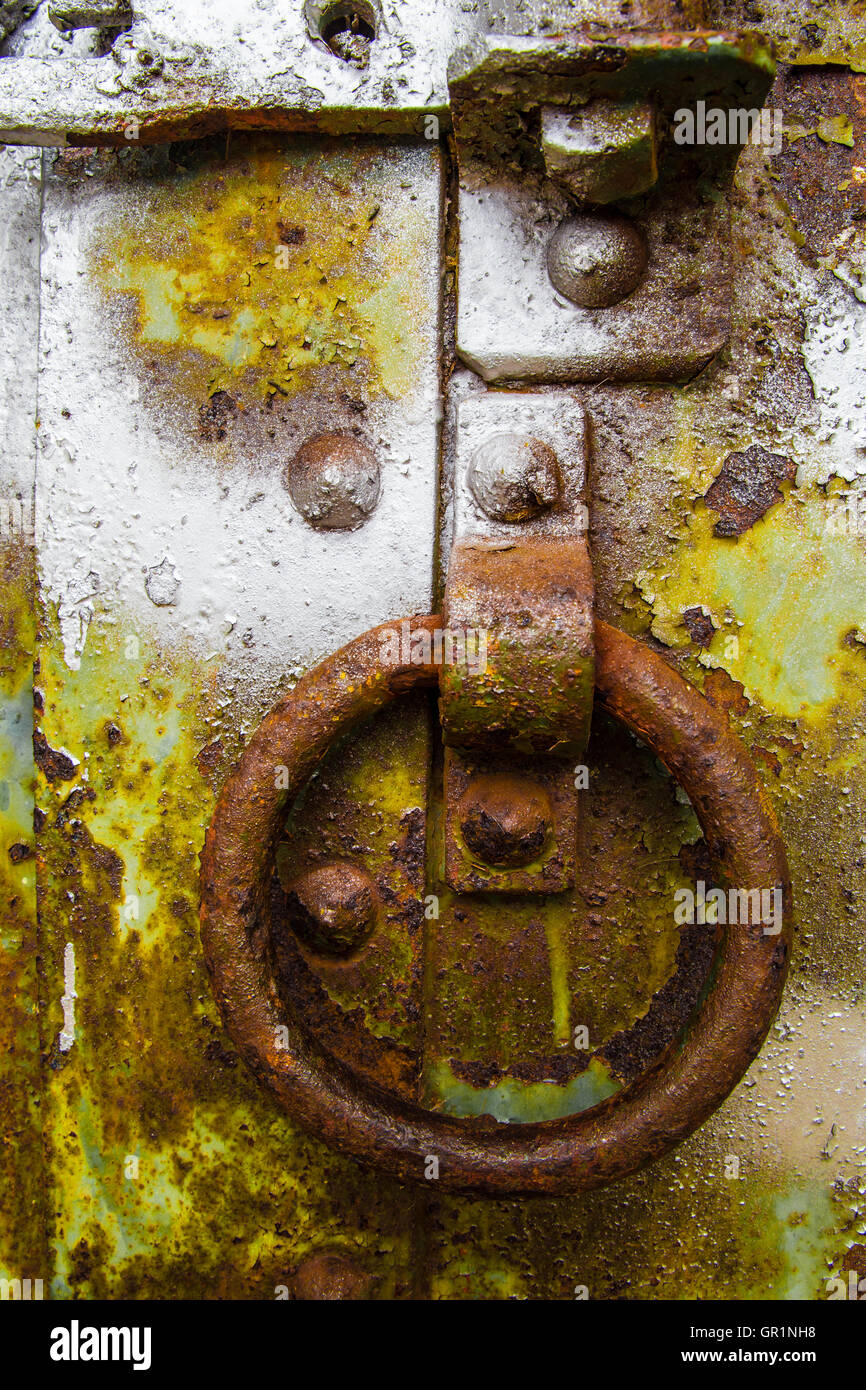 Rusty corroded details on painted steel door Stock Photo - Alamy