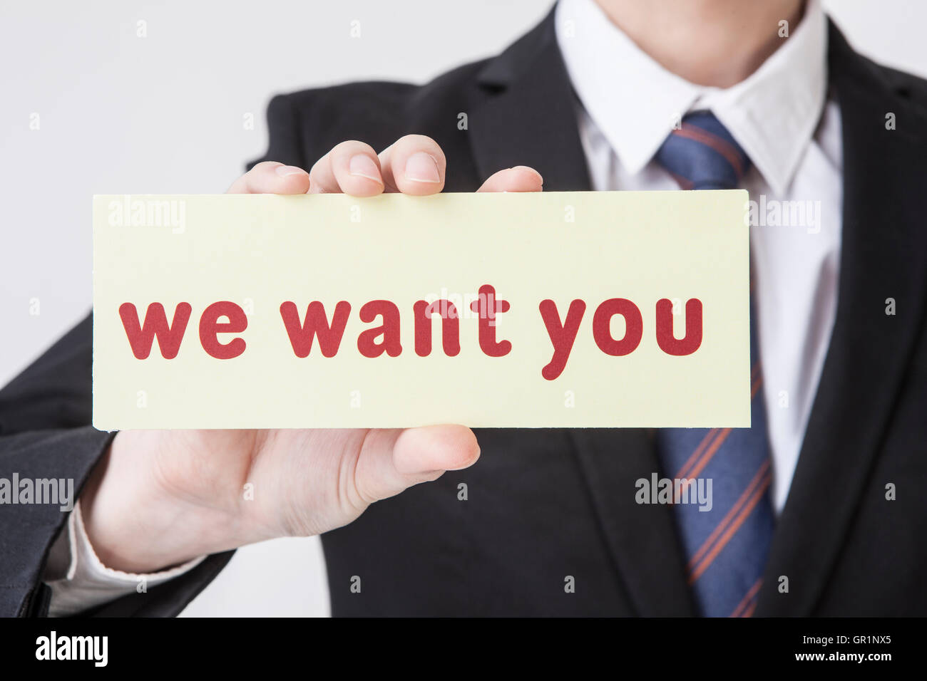 Businessman with help-wanted message Stock Photo - Alamy