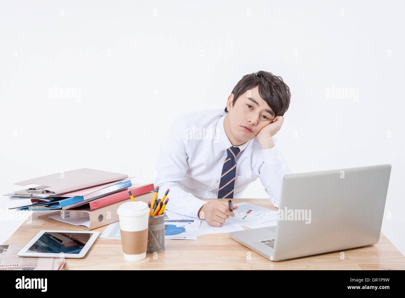 Tired businessman at work Stock Photo - Alamy