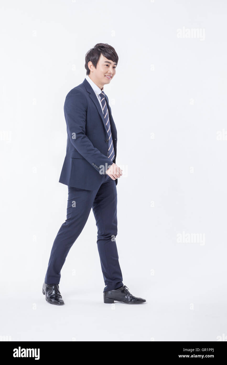 Businessman walking side view hi-res stock photography and images - Alamy