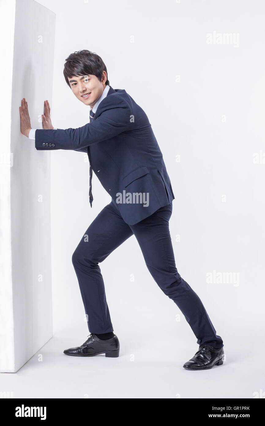 Pushing wall hi-res stock photography and images - Alamy