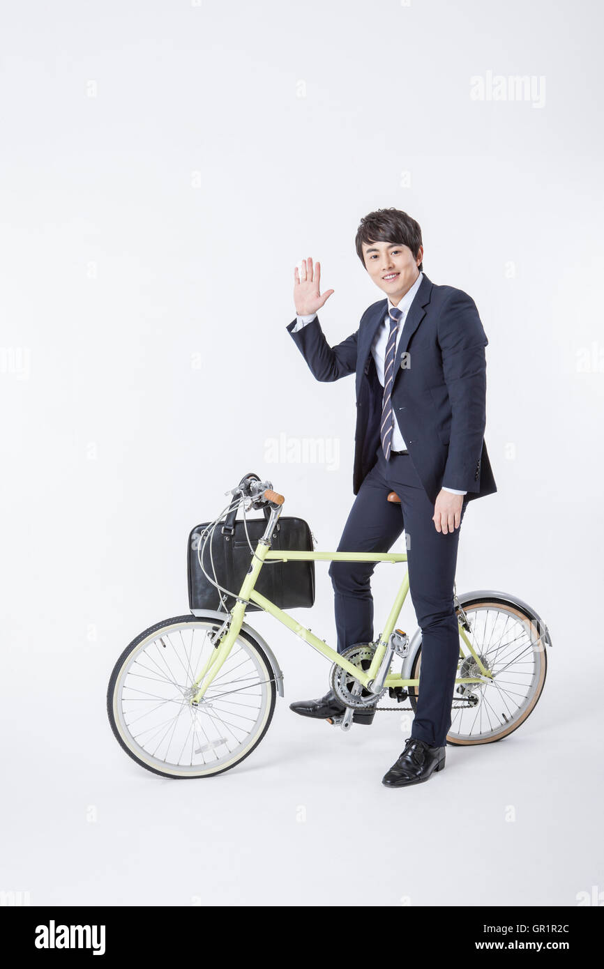 Businessman on bike hi-res stock photography and images - Alamy