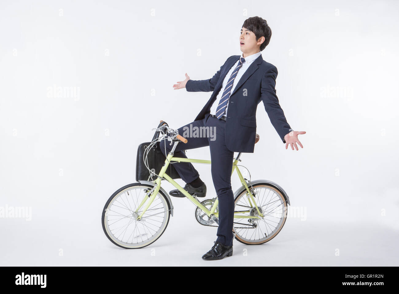 Businessman on bike hi-res stock photography and images - Alamy