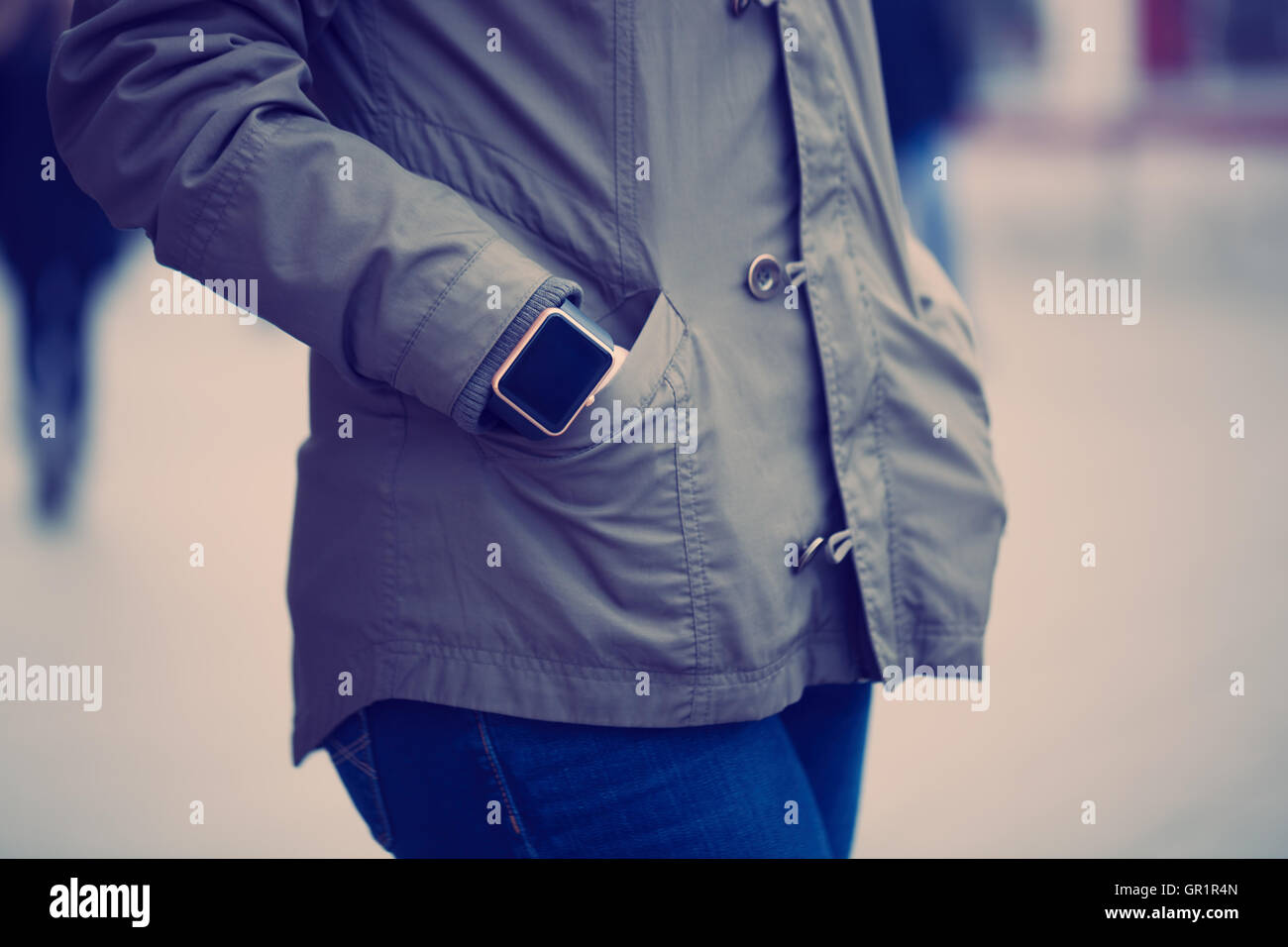 Girl wearing smart watch on her hand on the street. This new accessory ...