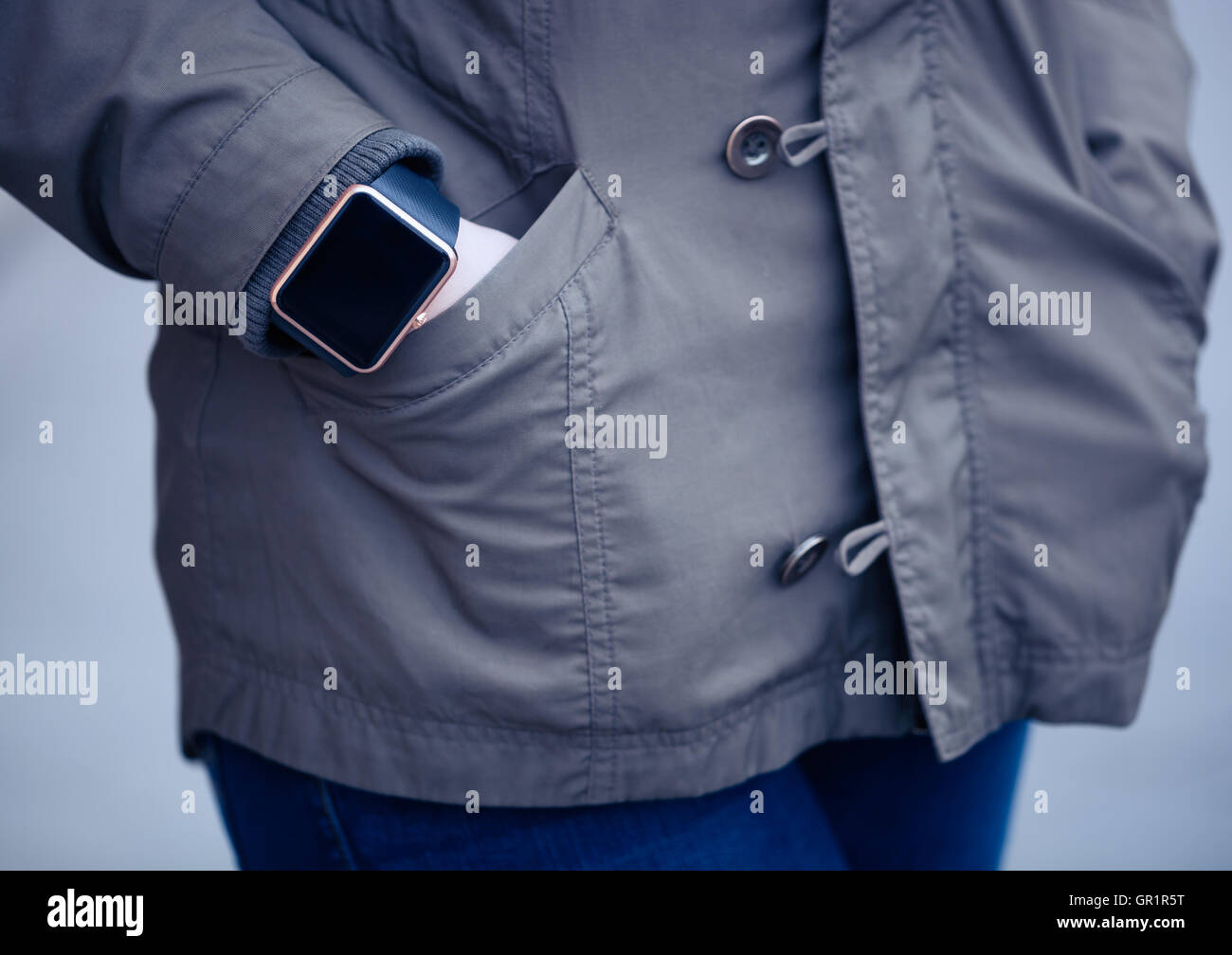 Girl wearing smart watch on her hand on the street. This new gadget ...