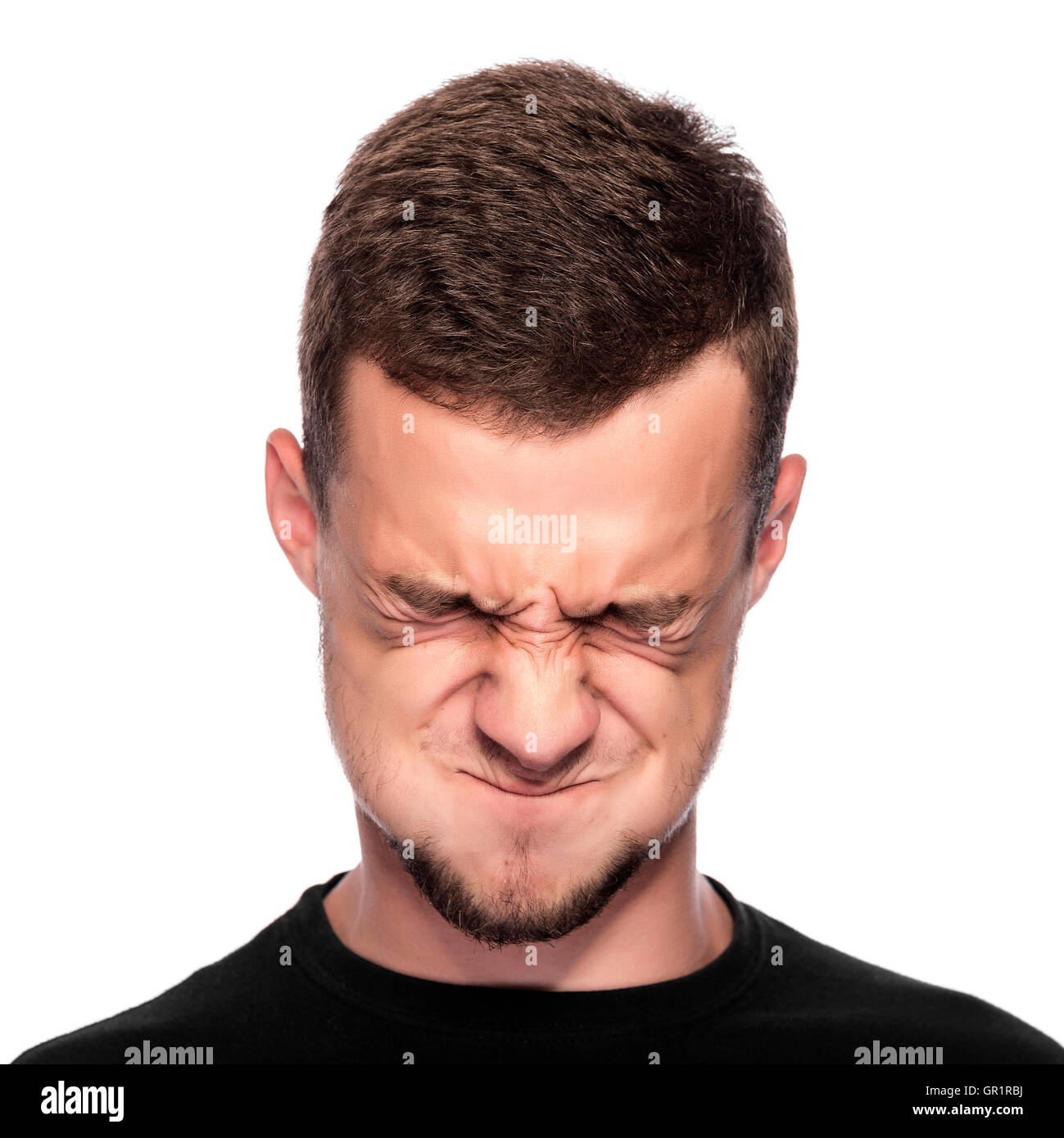 Stressful young man isolated on white background Stock Photo - Alamy