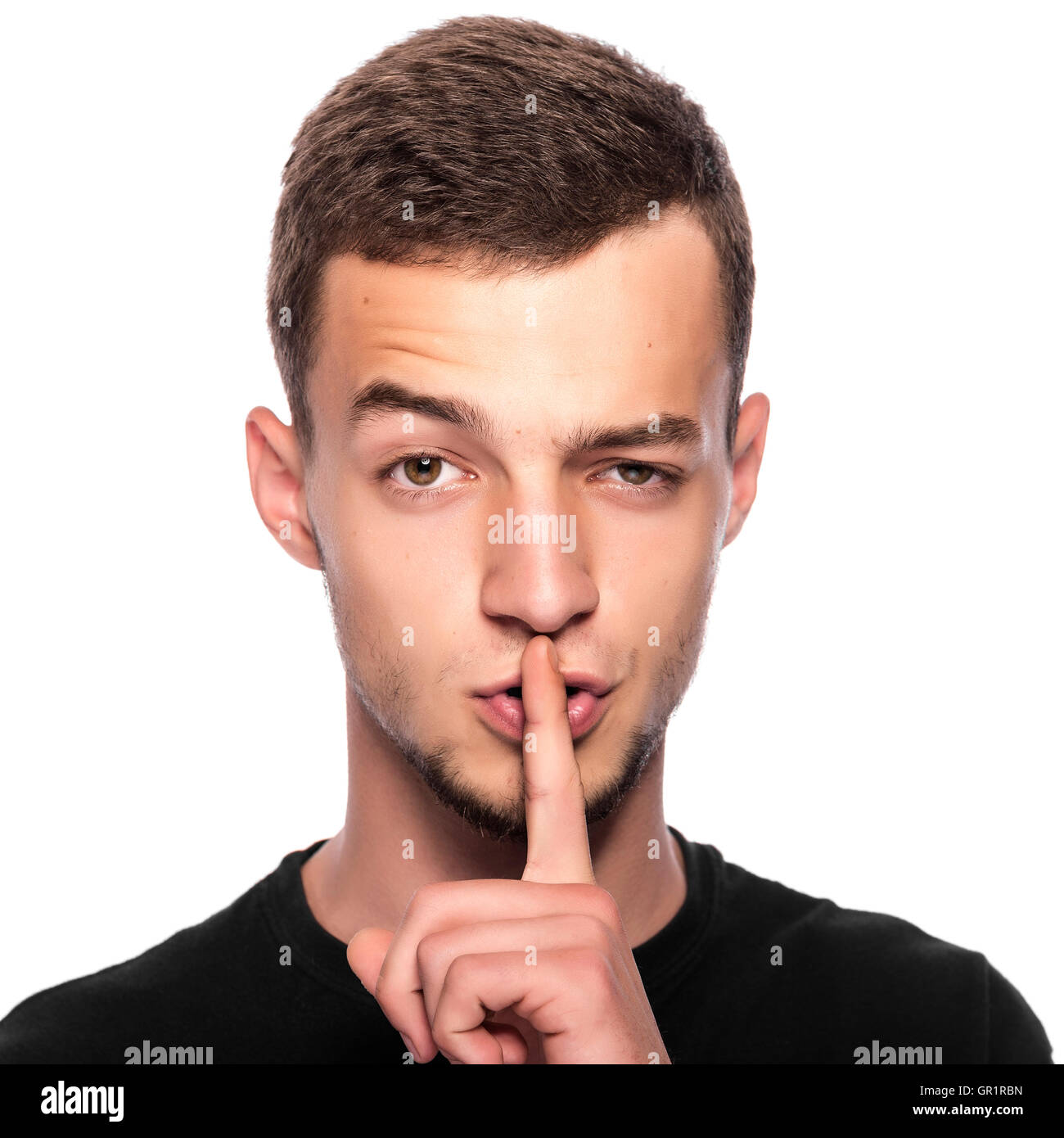 Man gesturing silence, quiet, on white background Stock Photo - Alamy