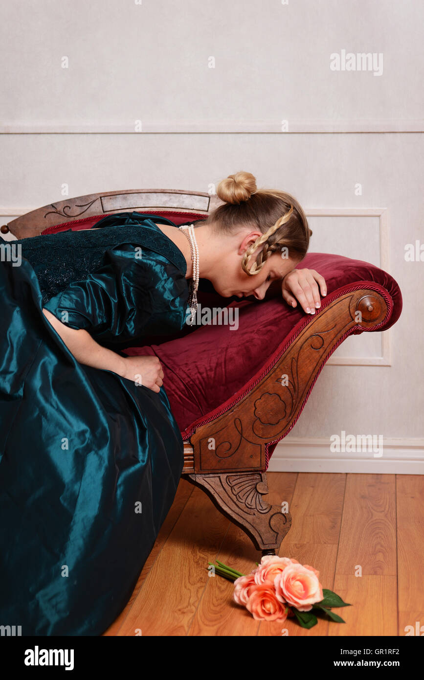 sad Victorian woman on fainting couch Stock Photo - Alamy