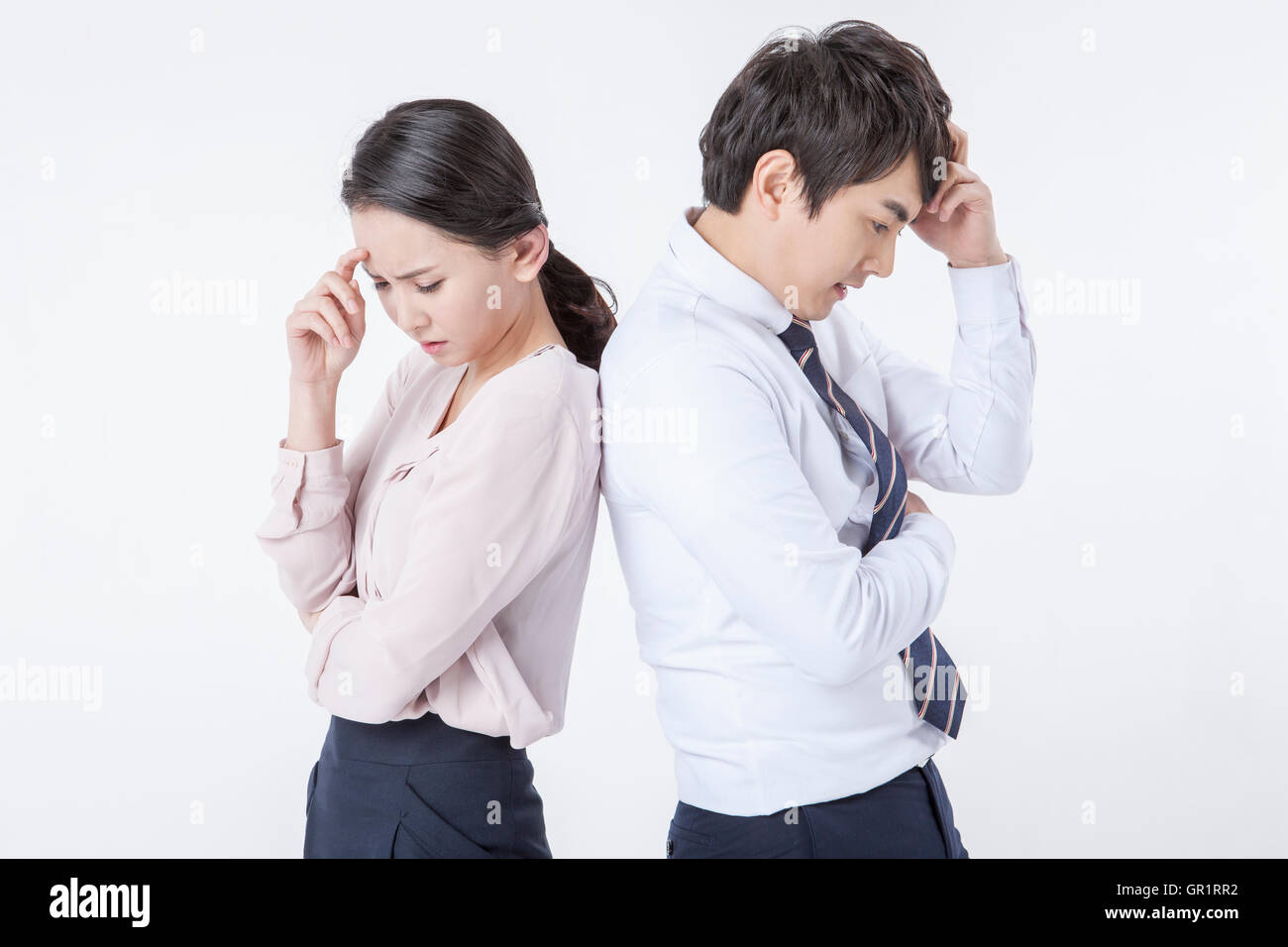 Working couple worried Stock Photo - Alamy