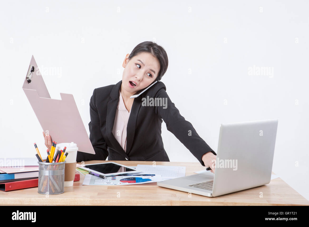 Portrait of busy businesswoman Stock Photo - Alamy