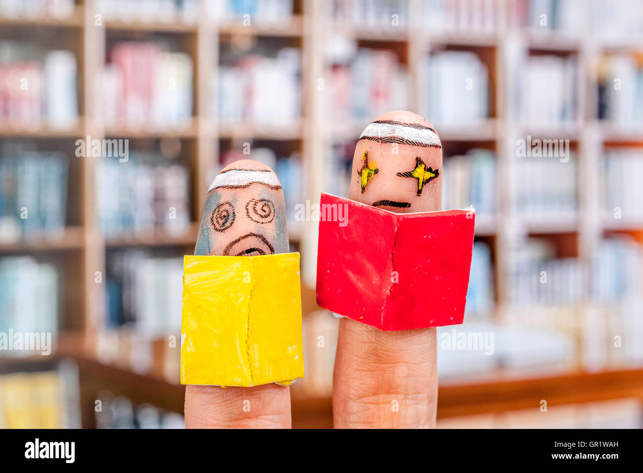 People reading books, finger art Stock Photo - Alamy