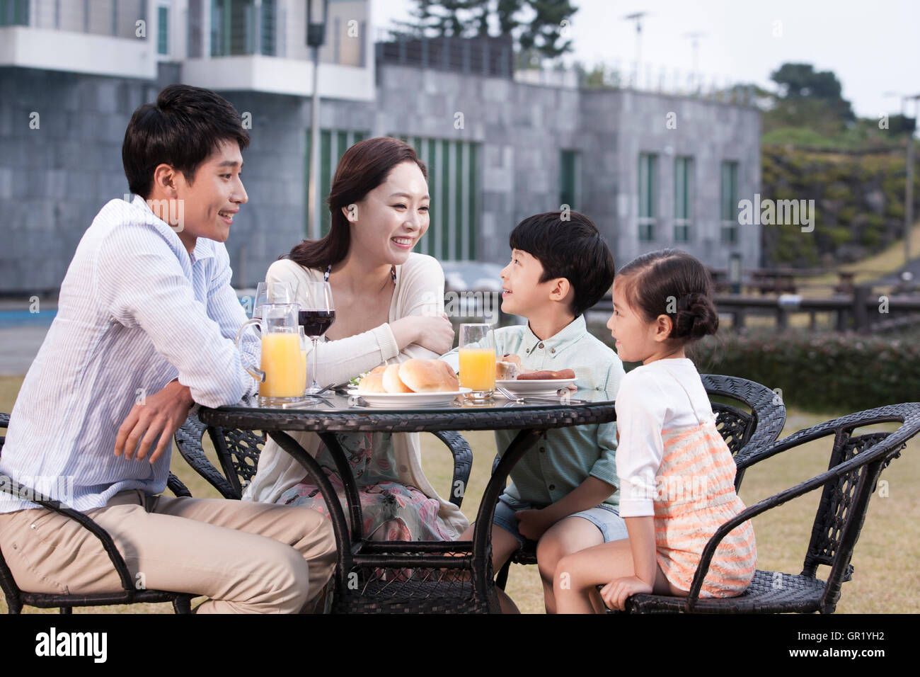 Harmonious family having meals at resort during summer vacation Stock ...