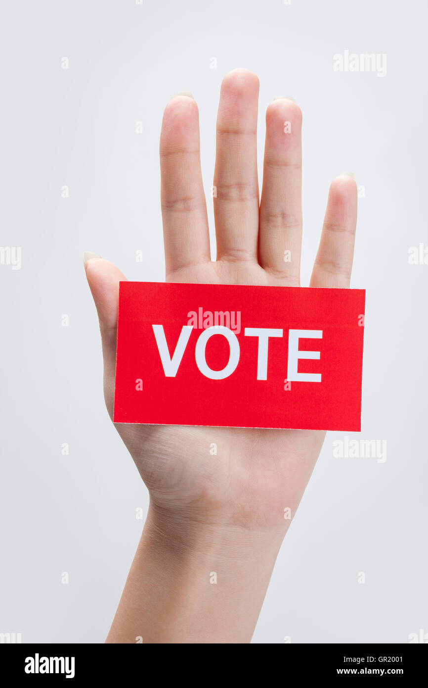 Hand showing the word of VOTE Stock Photo - Alamy