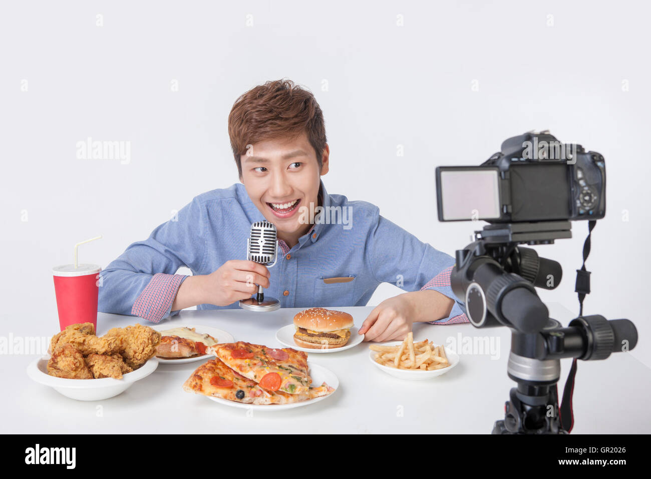 Talking into microphone hi-res stock photography and images - Alamy