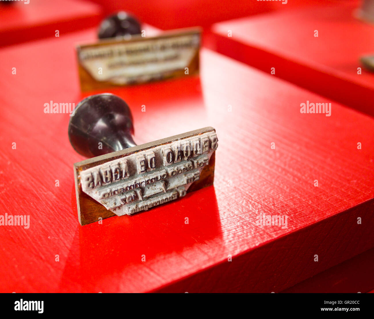 Rubber Stamps on Red. A pair of rubber stamps displayed on a bright red ...