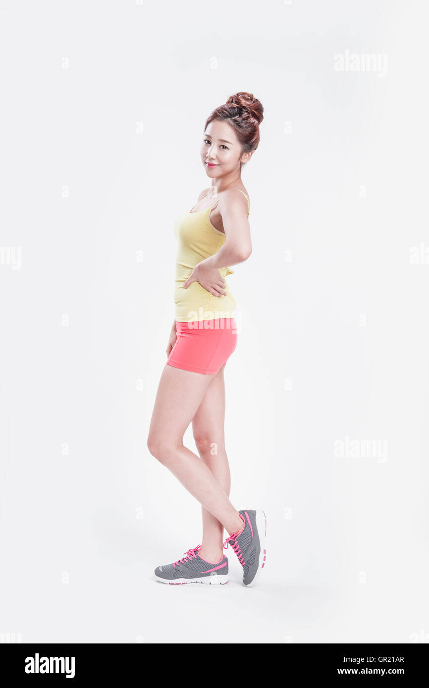 Woman posing in sports wears Stock Photo - Alamy