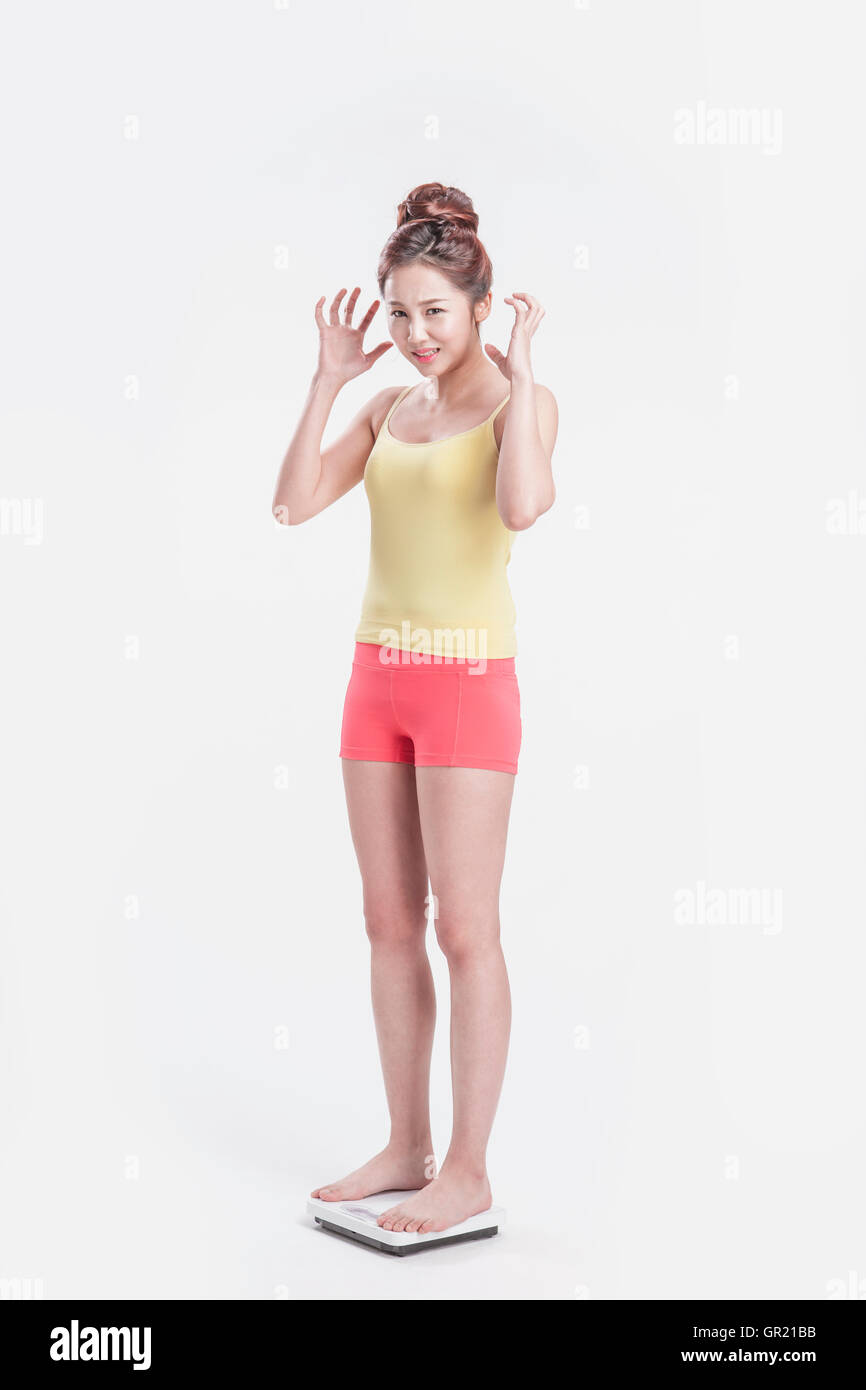 Woman taking weight Stock Photo - Alamy