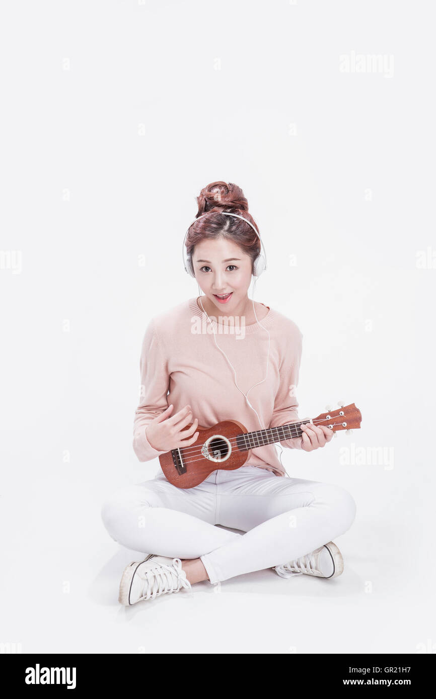 Woman playing instrument Stock Photo - Alamy