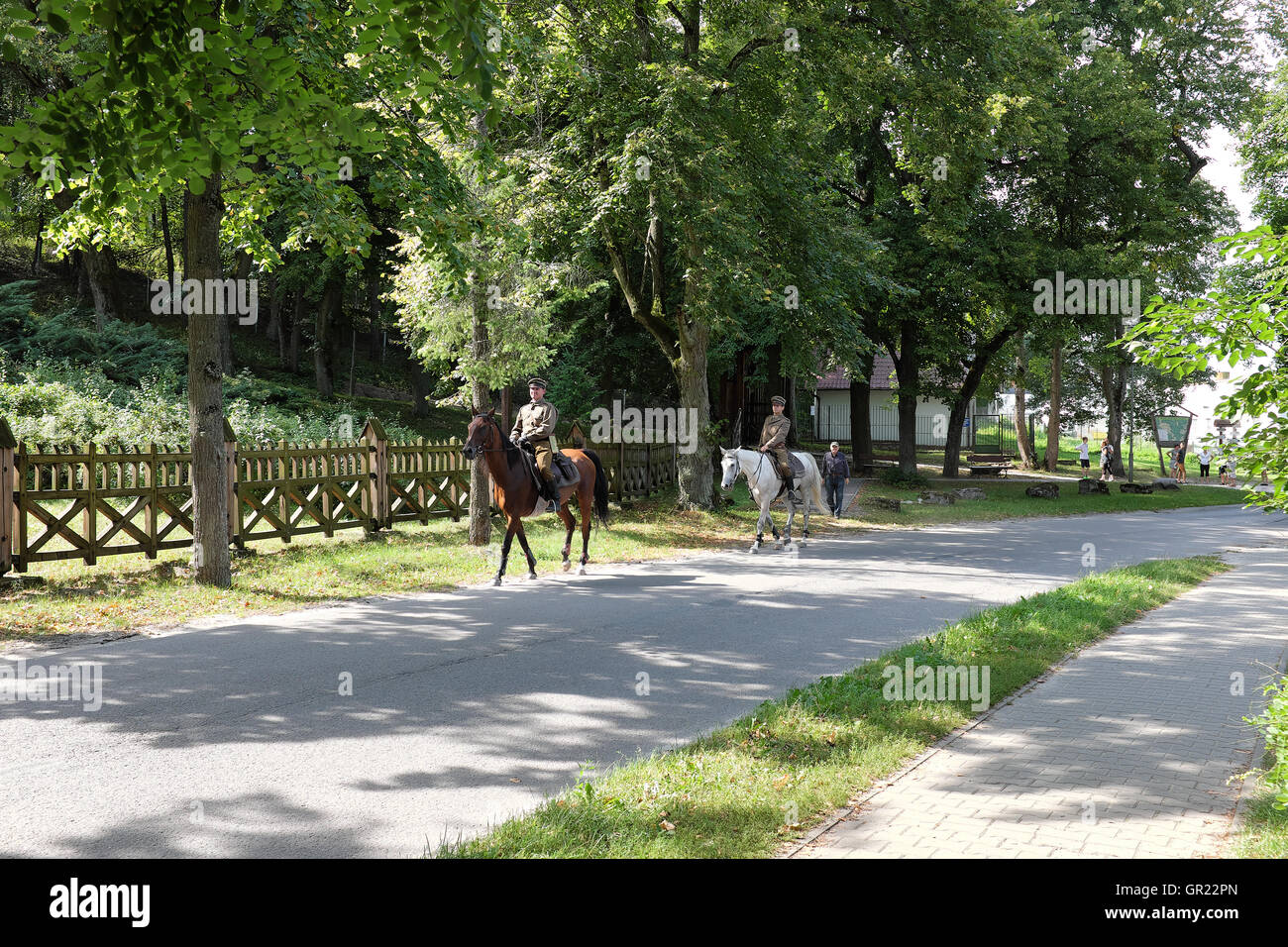 Two quards ride on horses at Roztoczanski National Park, Zwierzyniec ...