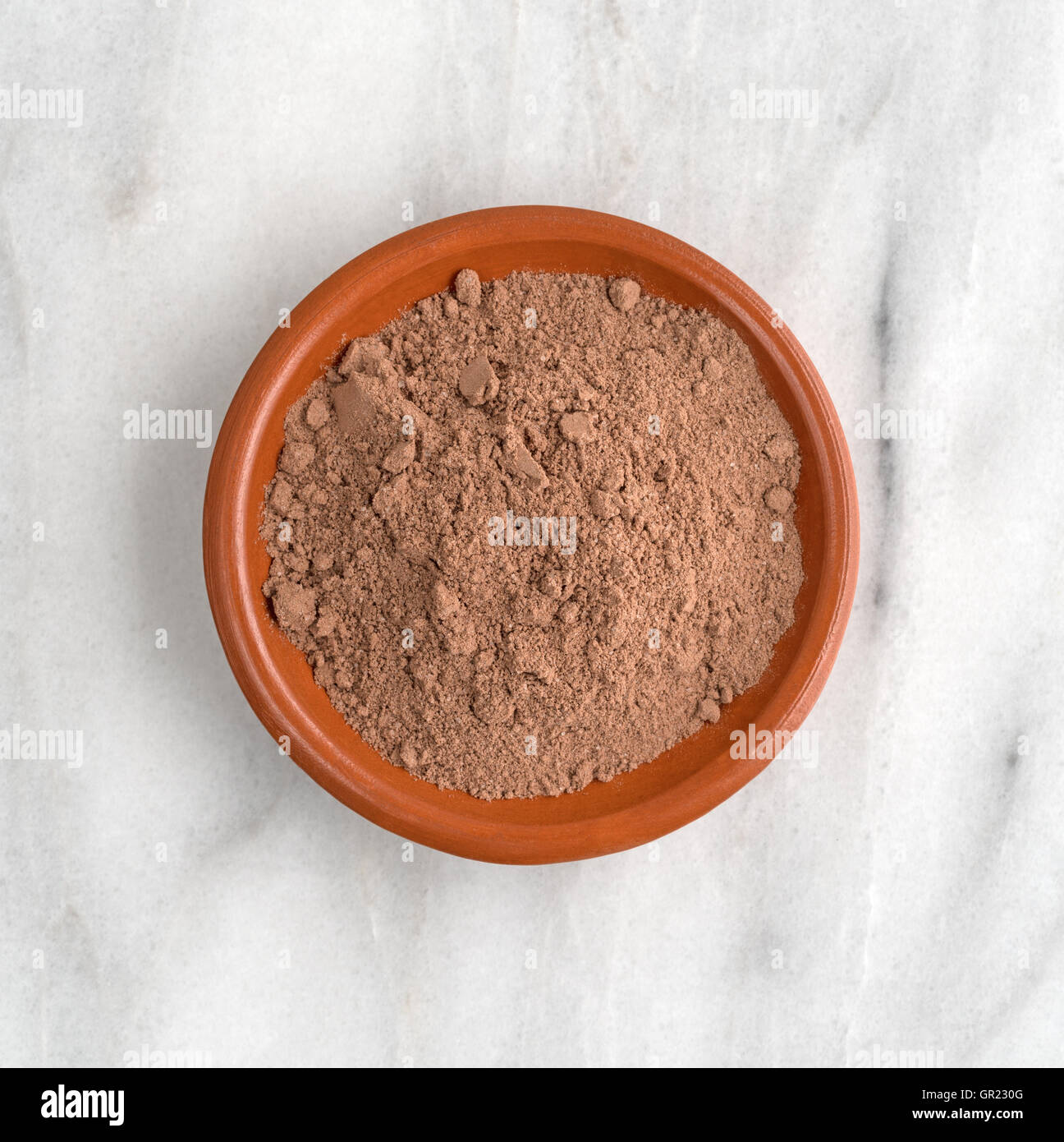 Cocoa powder in a small bowl on a gray marble counter top Stock Photo ...
