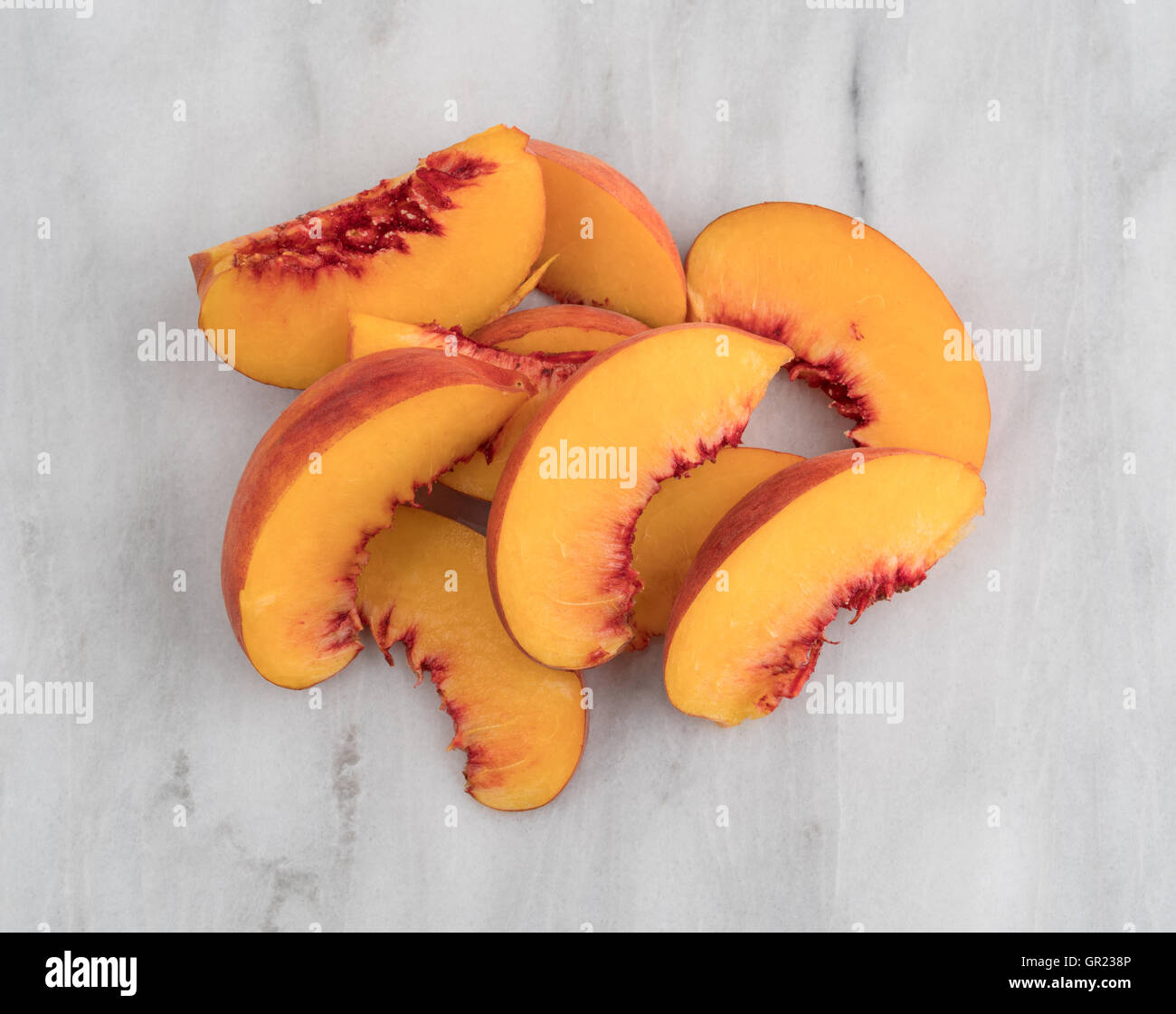 Top view of nectarine slices on a marble cutting board Stock Photo - Alamy