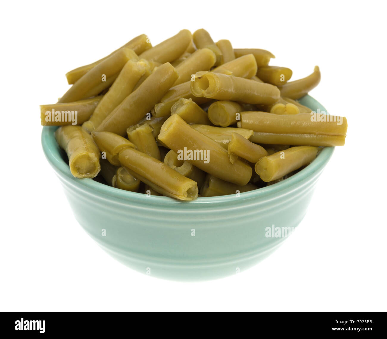 A serving of organic cut green beans in a small bowl isolated on a ...
