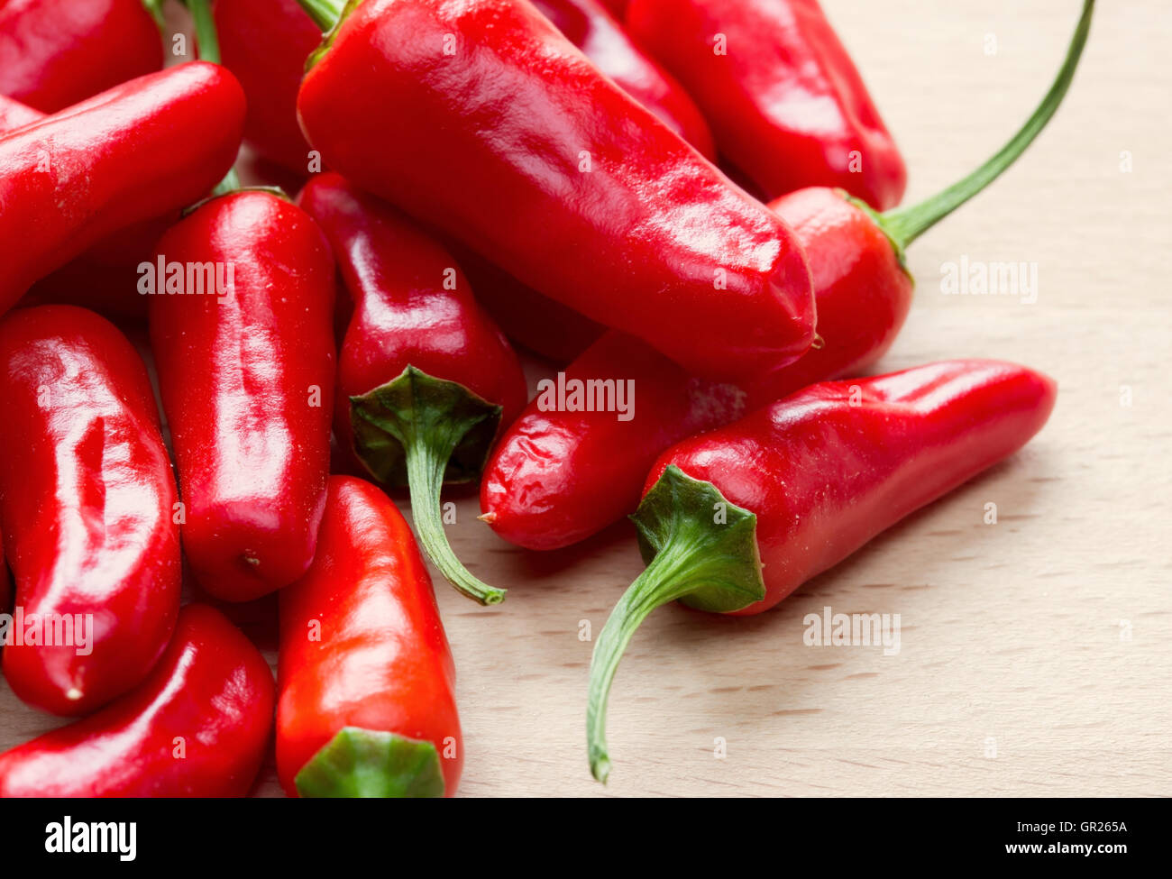 Red chilli pepper 'capsicum annuum' on a wooden chopping board Stock ...