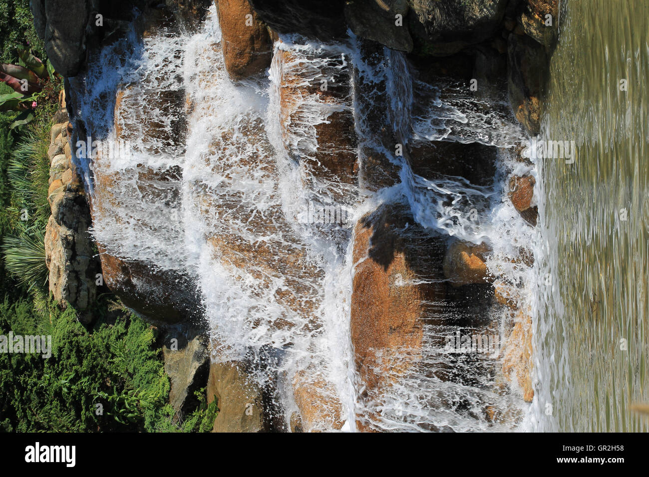 Waterfall splashing into stream nature at its best over place to sit ...