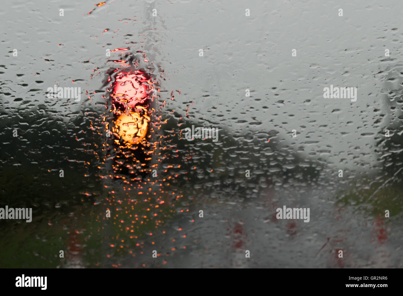 Traffic lights through windscreen and heavy rain Stock Photo - Alamy